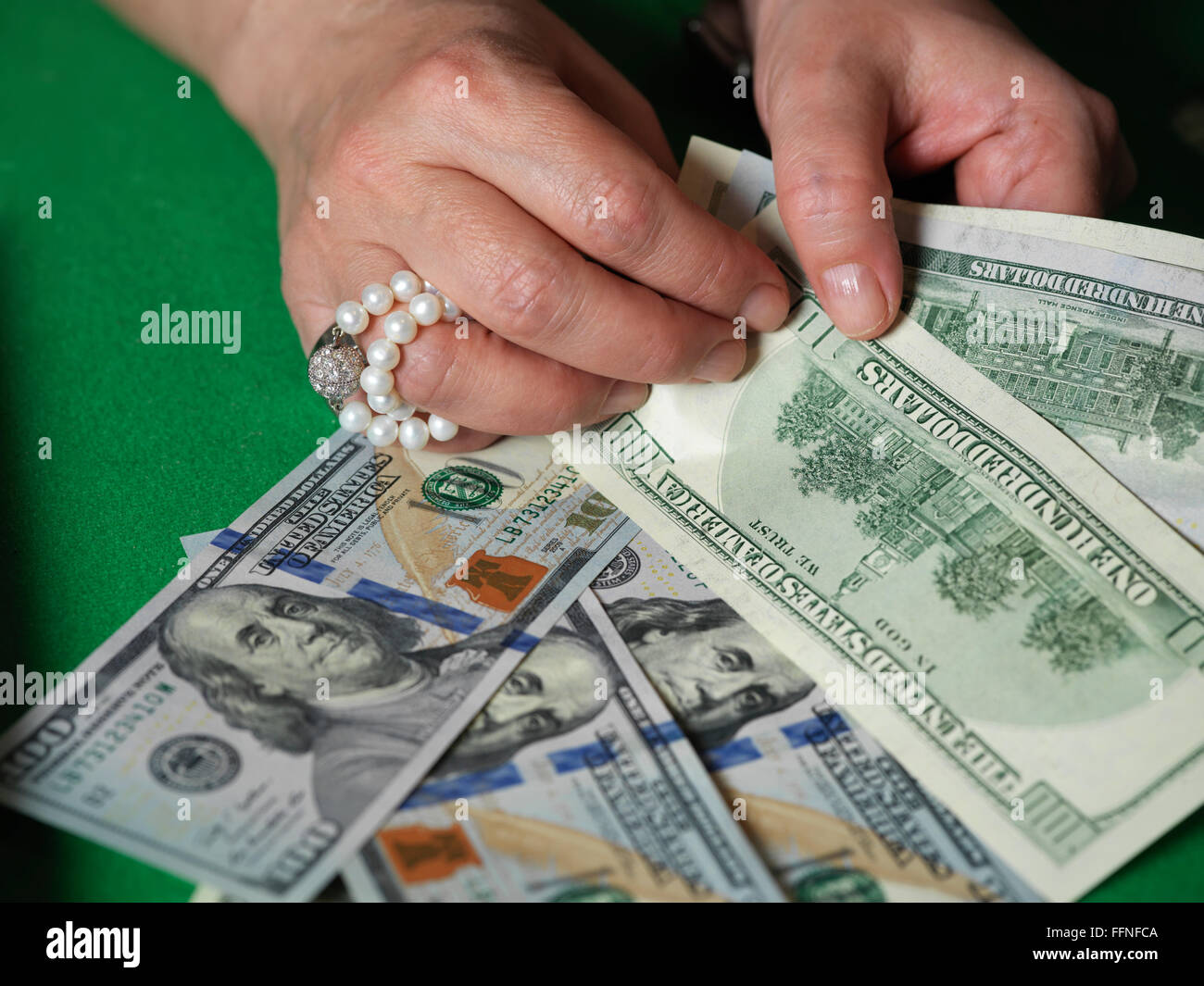 Female hands counting cash Stock Photo - Alamy