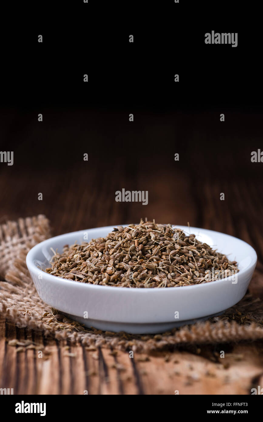 Heap of dried Anise Seeds (close-up shot) on vintage wooden background ...