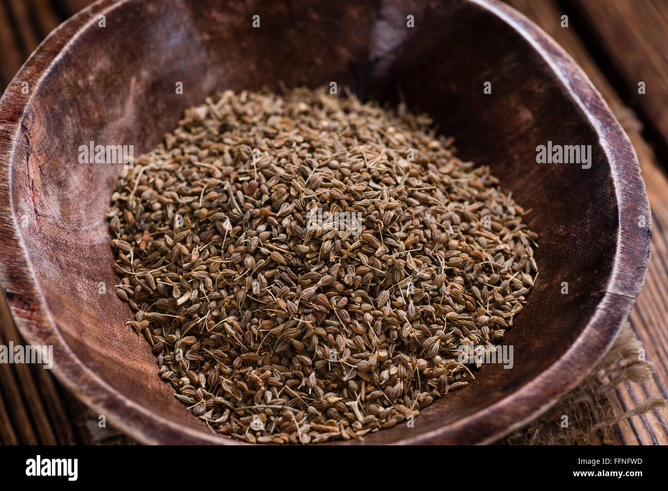 Heap of dried Anise Seeds (close-up shot) on vintage wooden background ...