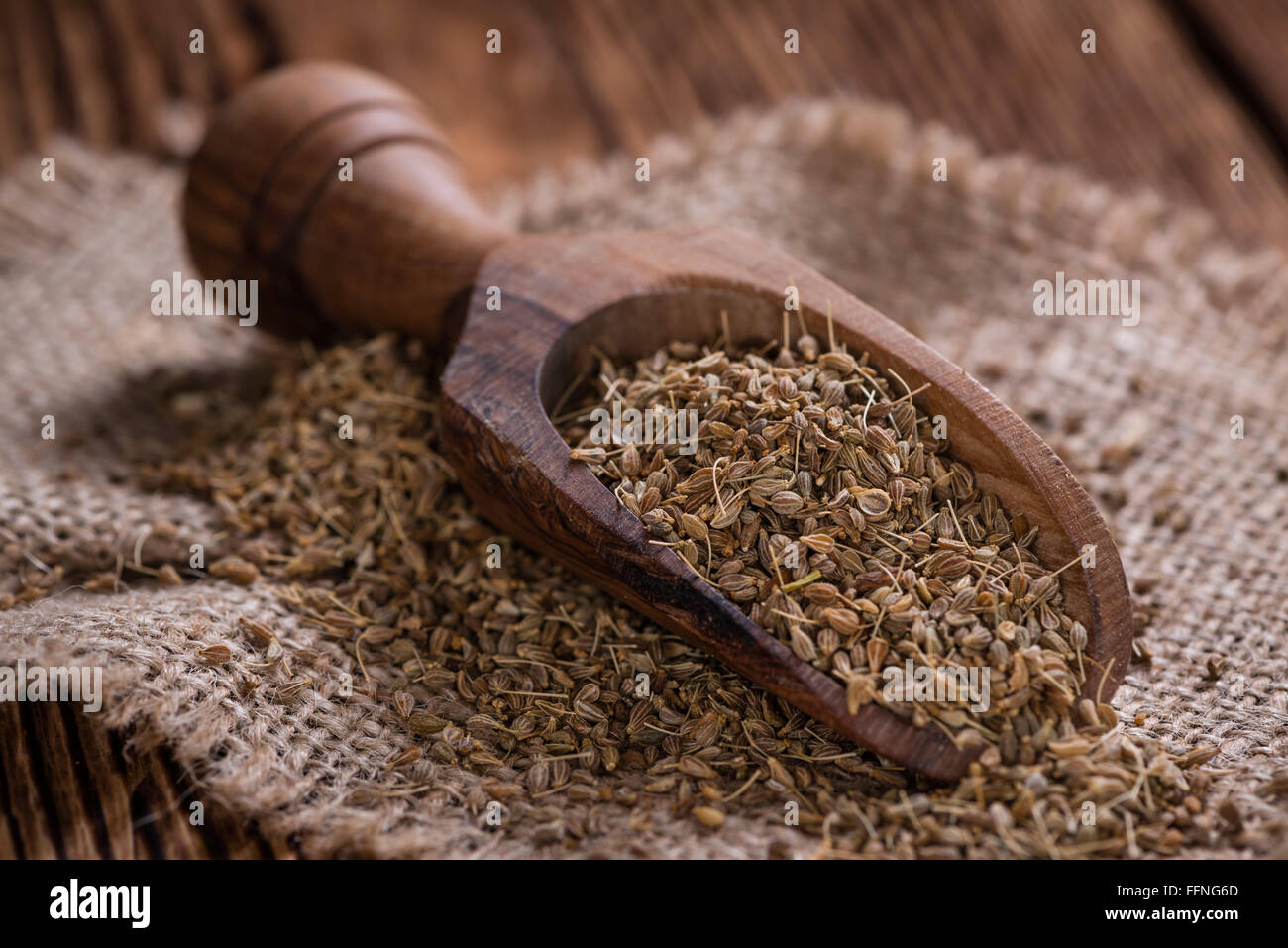 Heap of dried Anise Seeds (close-up shot) on vintage wooden background ...