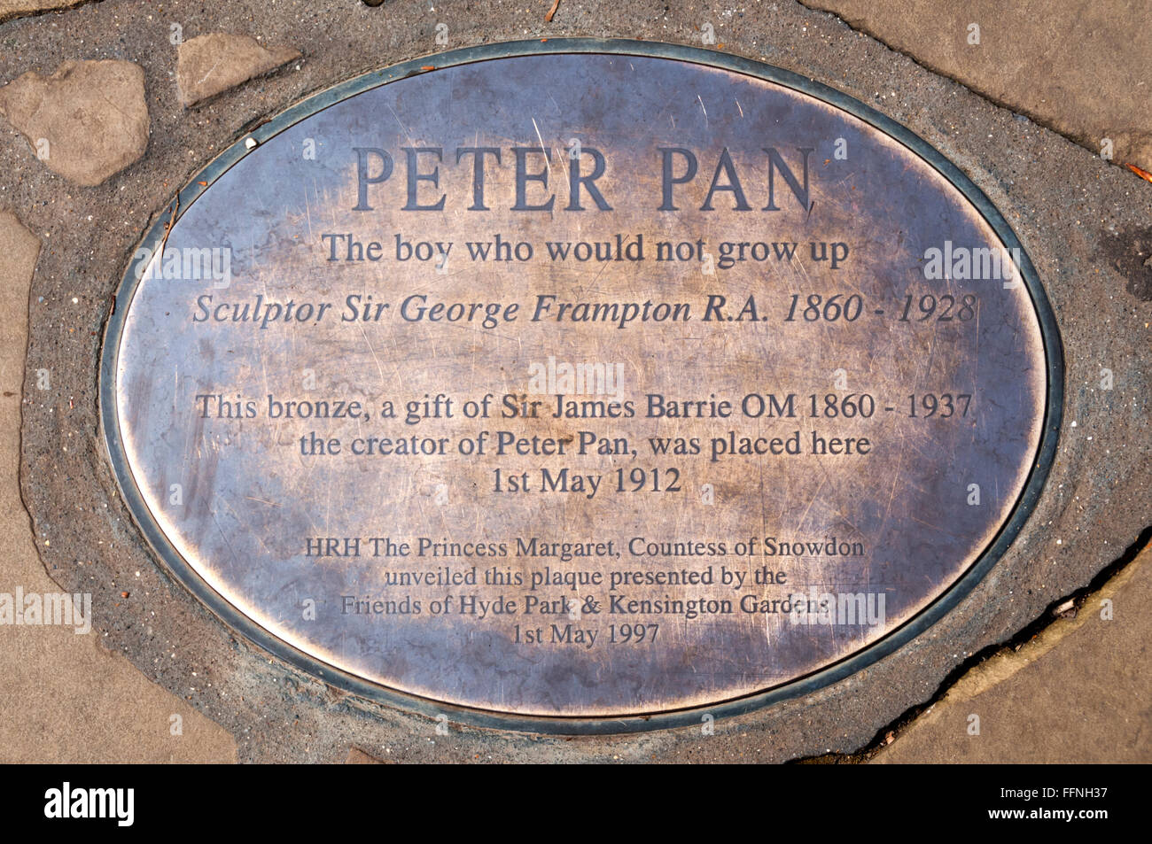 Plaque in front of Peter Pan statue in Kensington Gardens Stock Photo ...