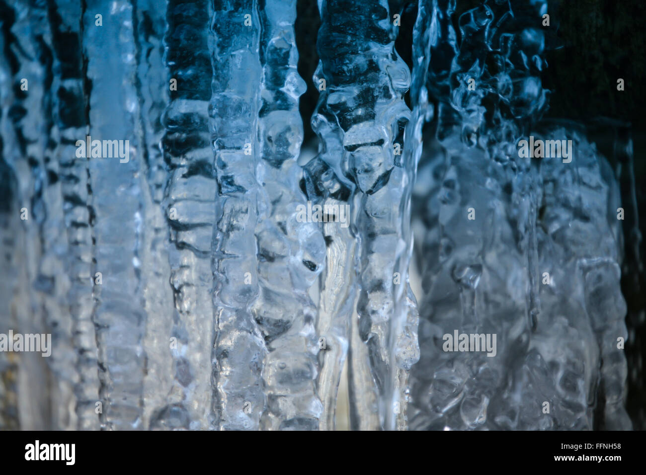 Ice Blue. Natural ice formation, large icicles looking like stalactites ...