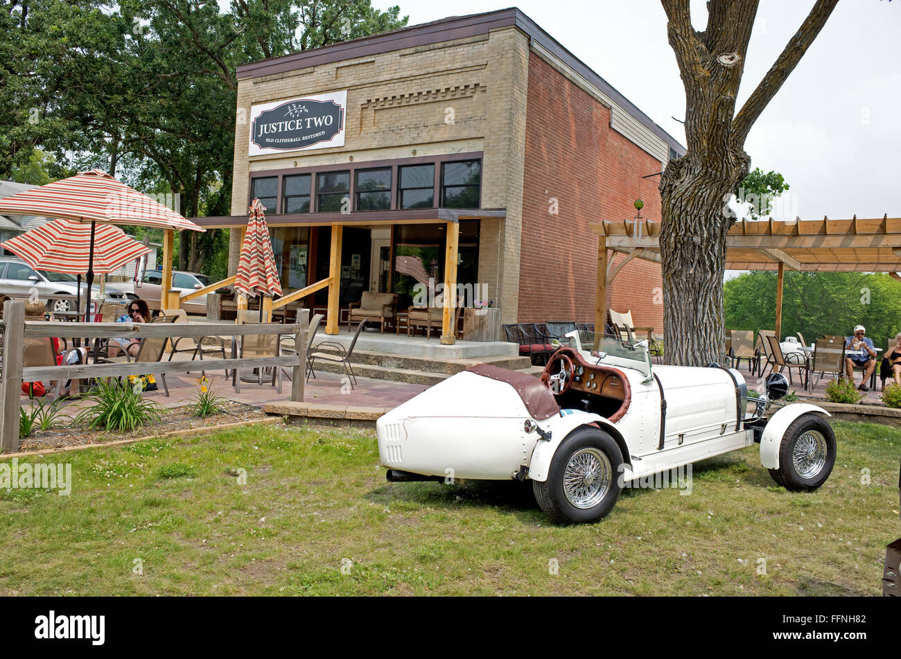 Patrons enjoying coffee and ice cream on the patios at the restored ...