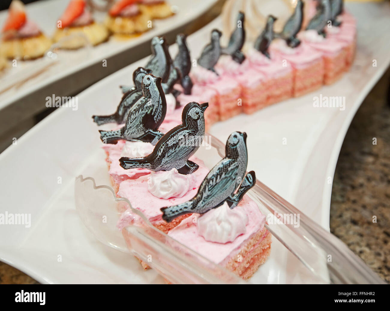 Selection of sweet desserts on display at a luxury restaurant buffet ...