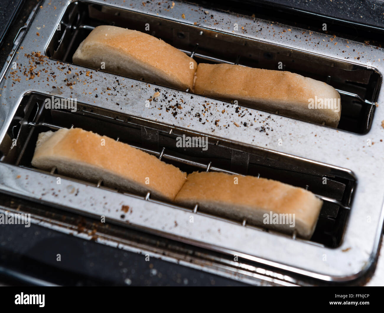 Toast Bread in a toaster (detailed close-up shot Stock Photo - Alamy