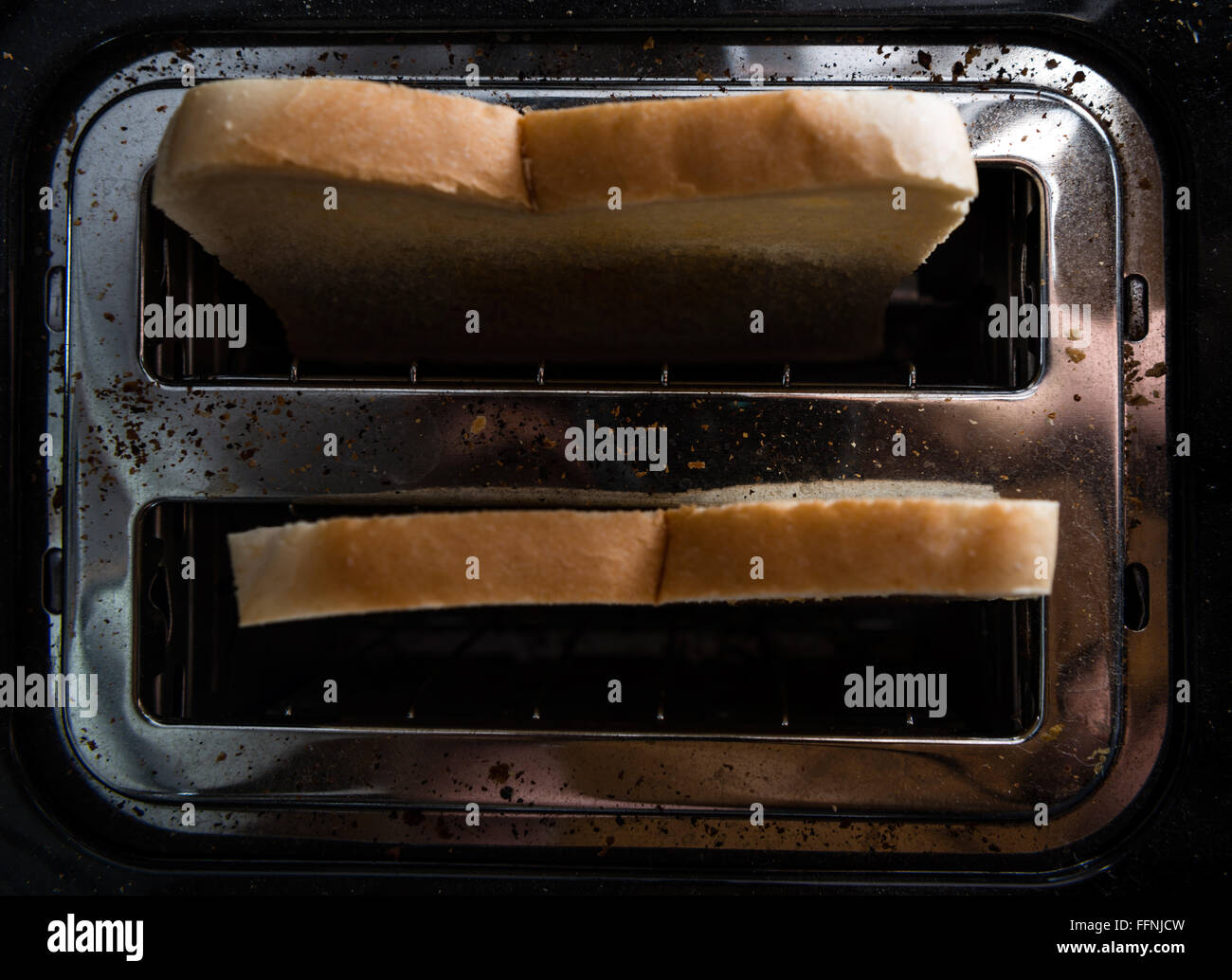 Toast Bread in a toaster (detailed close-up shot Stock Photo - Alamy