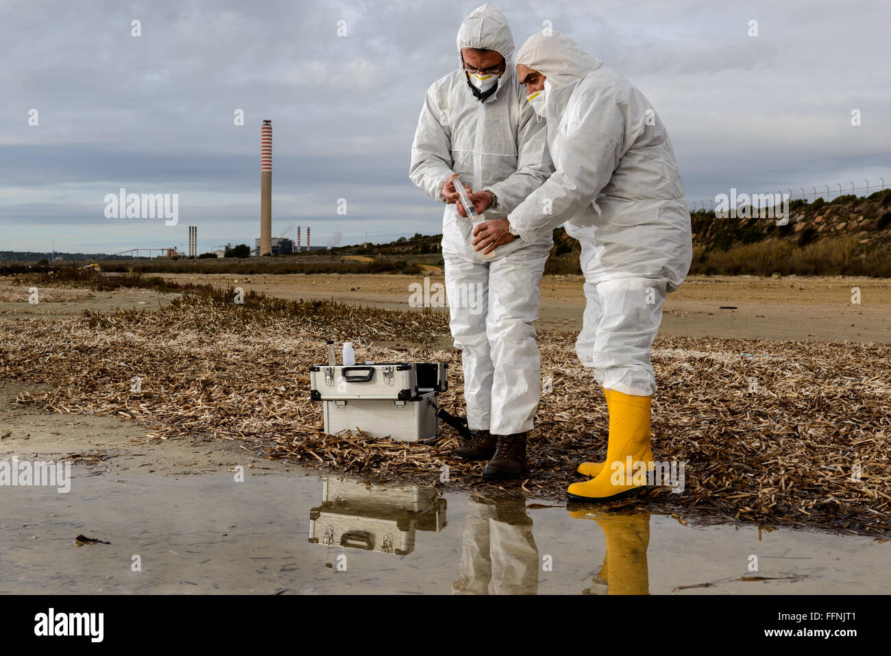 Experts analyze the water in a contaminated environment Stock Photo - Alamy