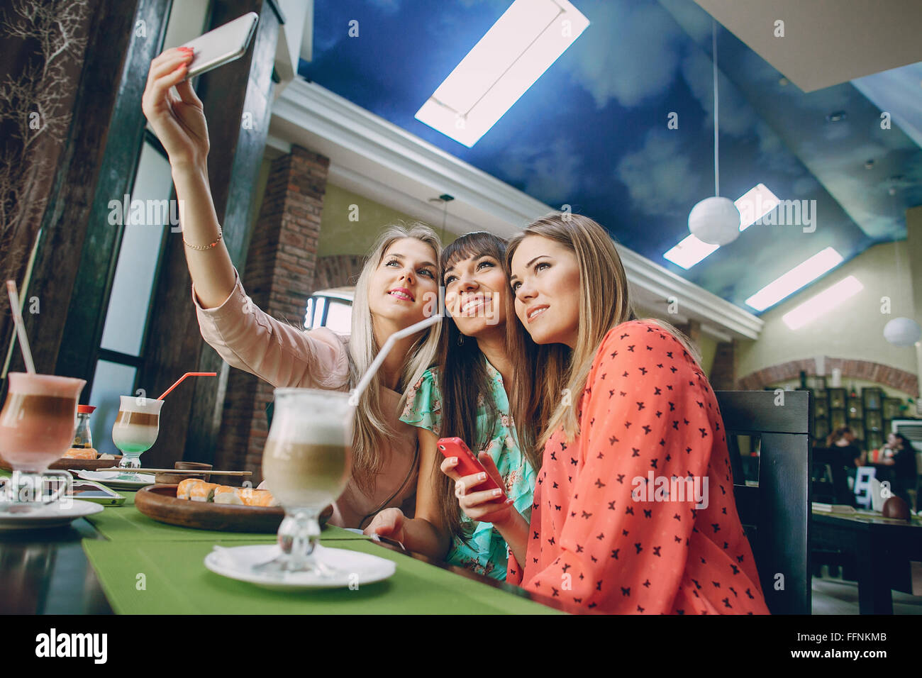 Girls with phones Stock Photo - Alamy