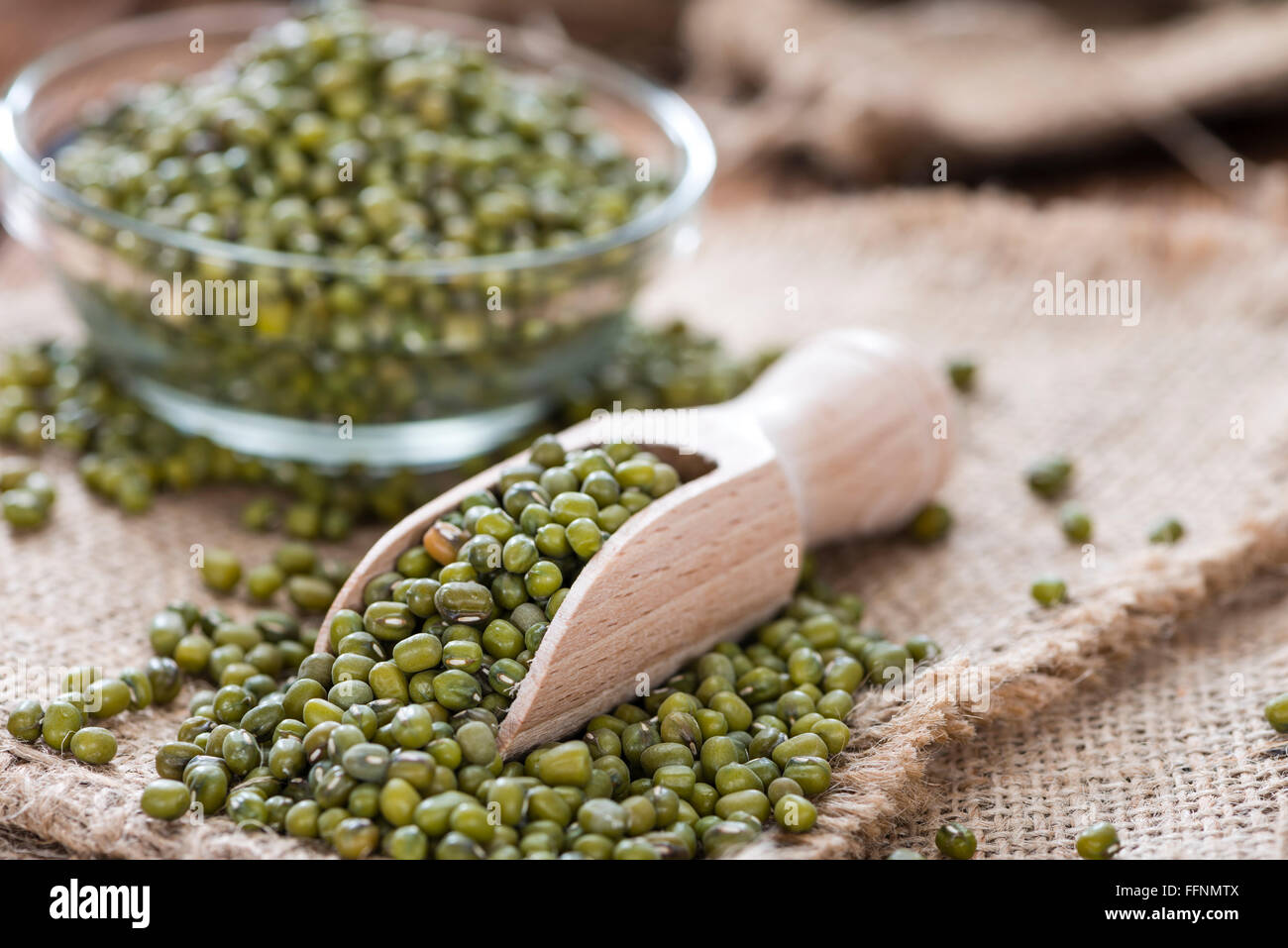 Some Mung Beans on an old wooden table (close-up shot Stock Photo - Alamy