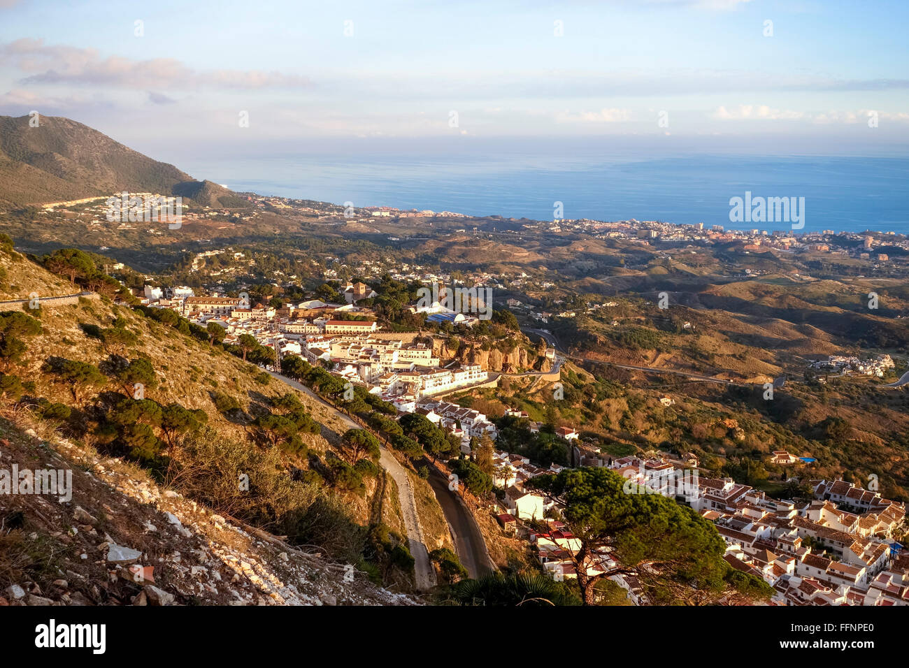 Bird view of the white washed village of Mijas Pueblo, during sunset in ...