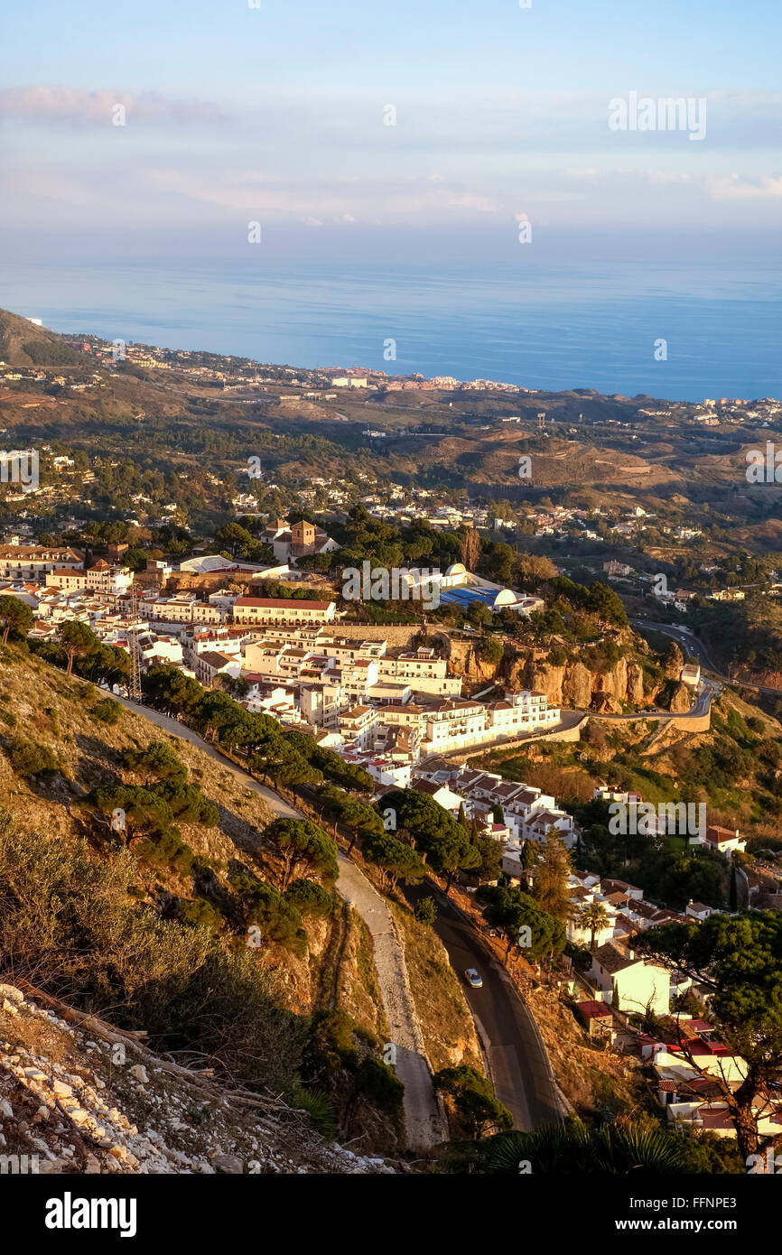 Bird view of the white washed village of Mijas Pueblo, during sunset in ...