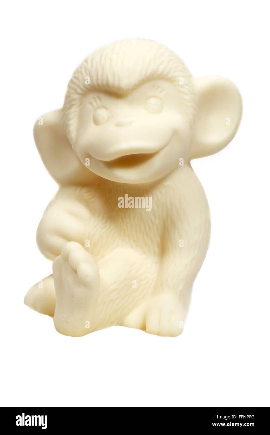 Isolated white chocolate monkey over white close up Stock Photo - Alamy