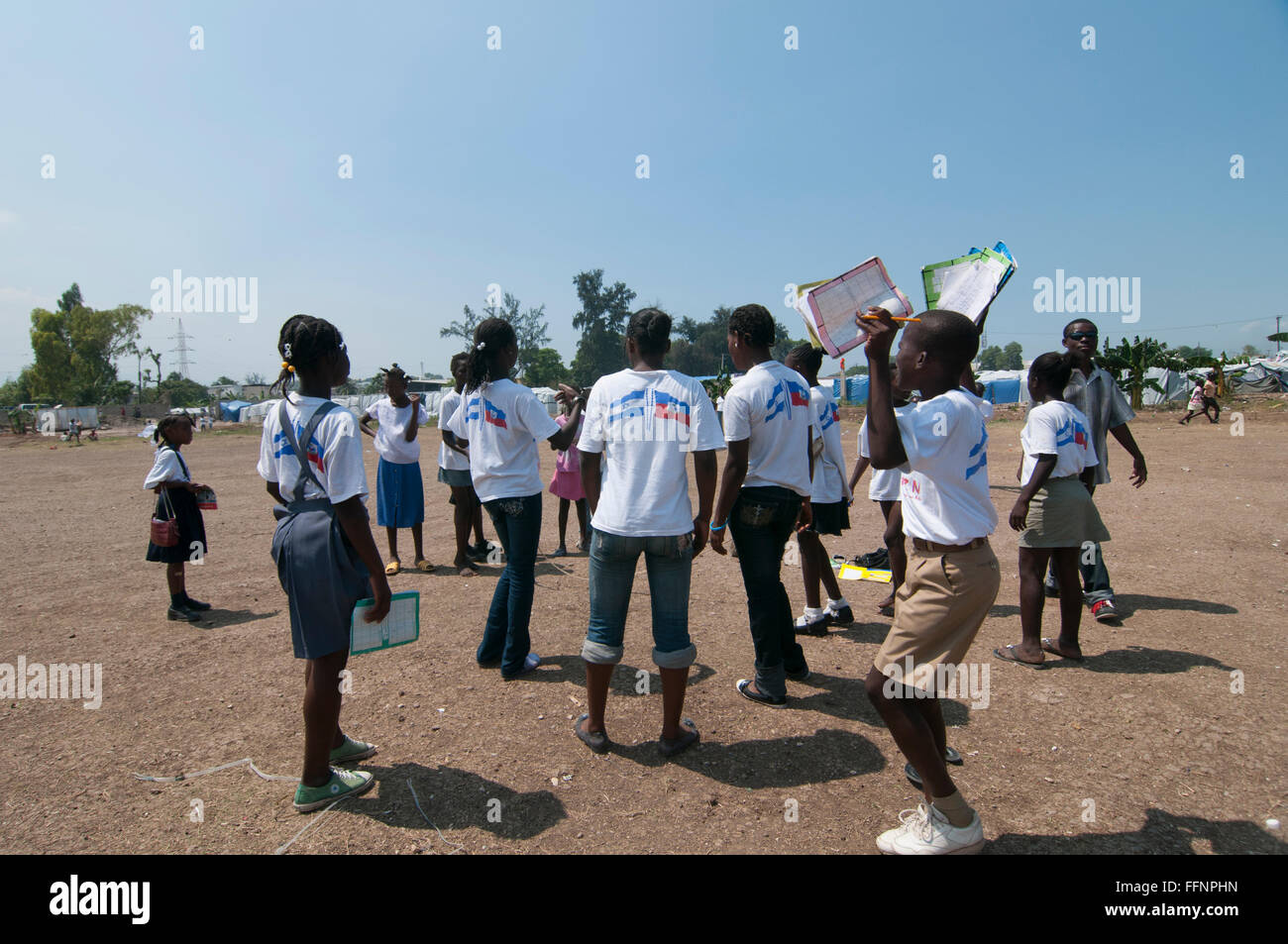 Young children wearing T Shirts bearing the Israel and Haiti flags ...