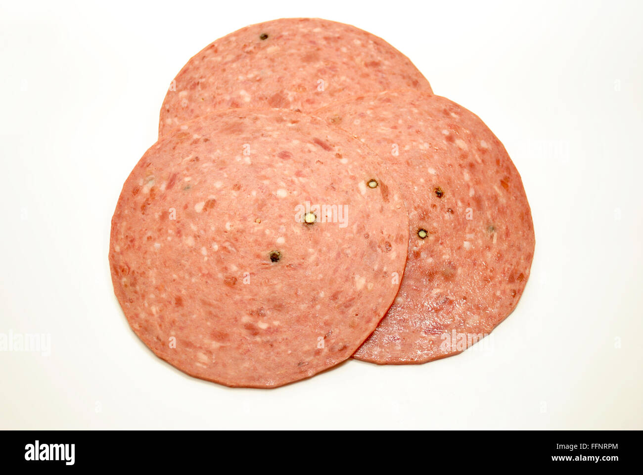 Three Slices of Deli Meat Cotta Salami Stock Photo - Alamy