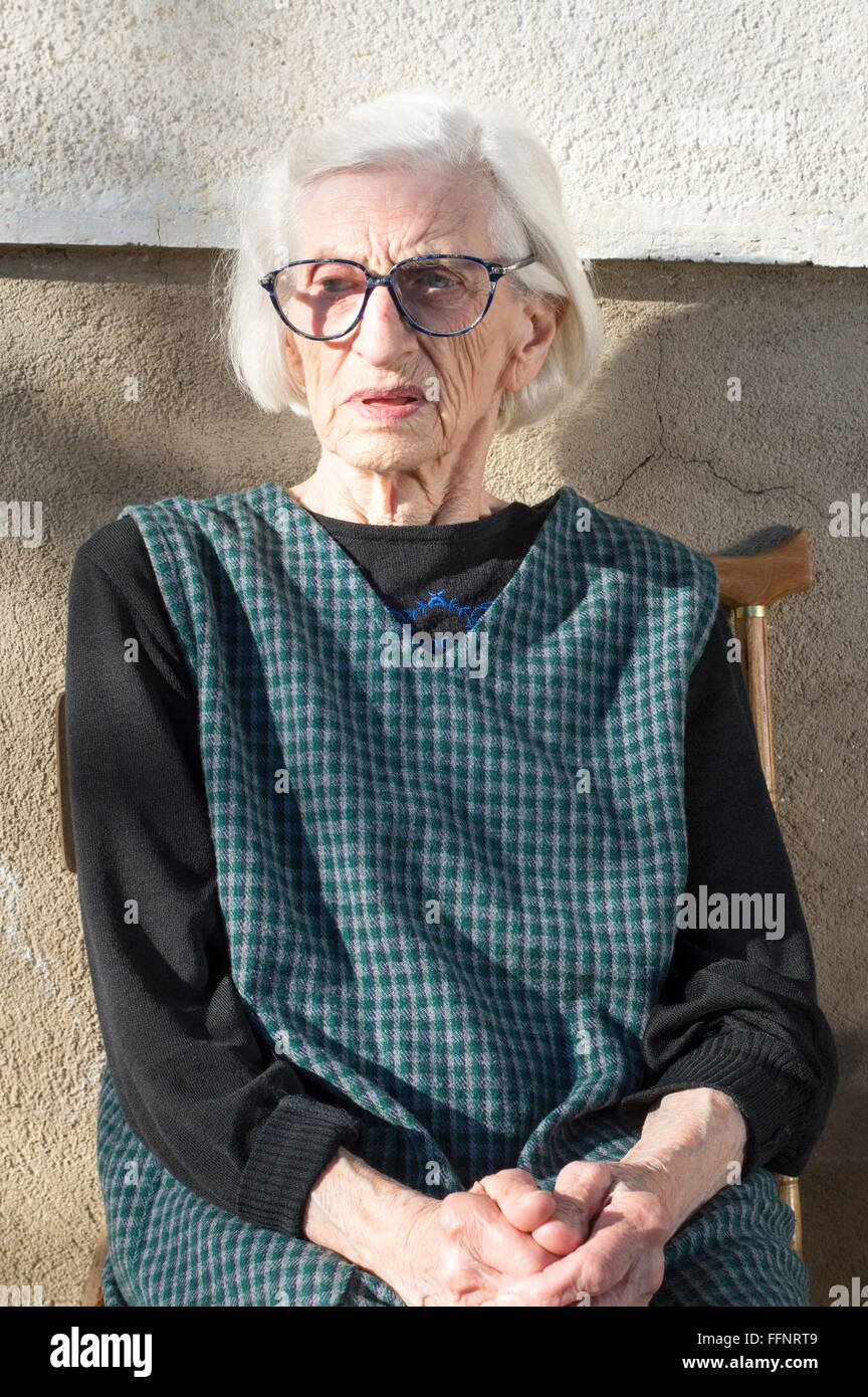 Portrait of a ninety years old grandma sitting outdoors Stock Photo - Alamy