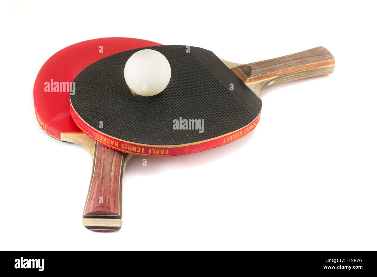 Two ping-pong rackets and a ball isolated Stock Photo - Alamy