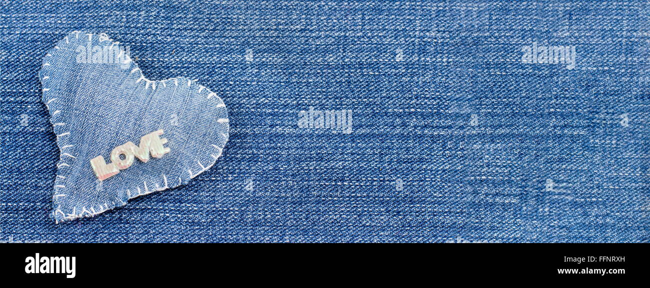Denim heart with the word love on it on Denim background Stock Photo ...