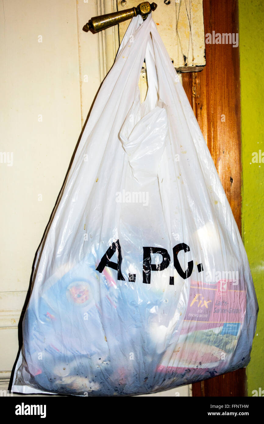 Garbage in a designer plastic bag Stock Photo - Alamy