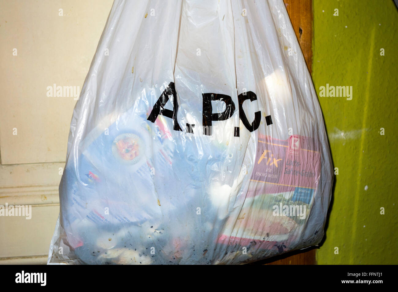 Garbage in a designer plastic bag Stock Photo - Alamy