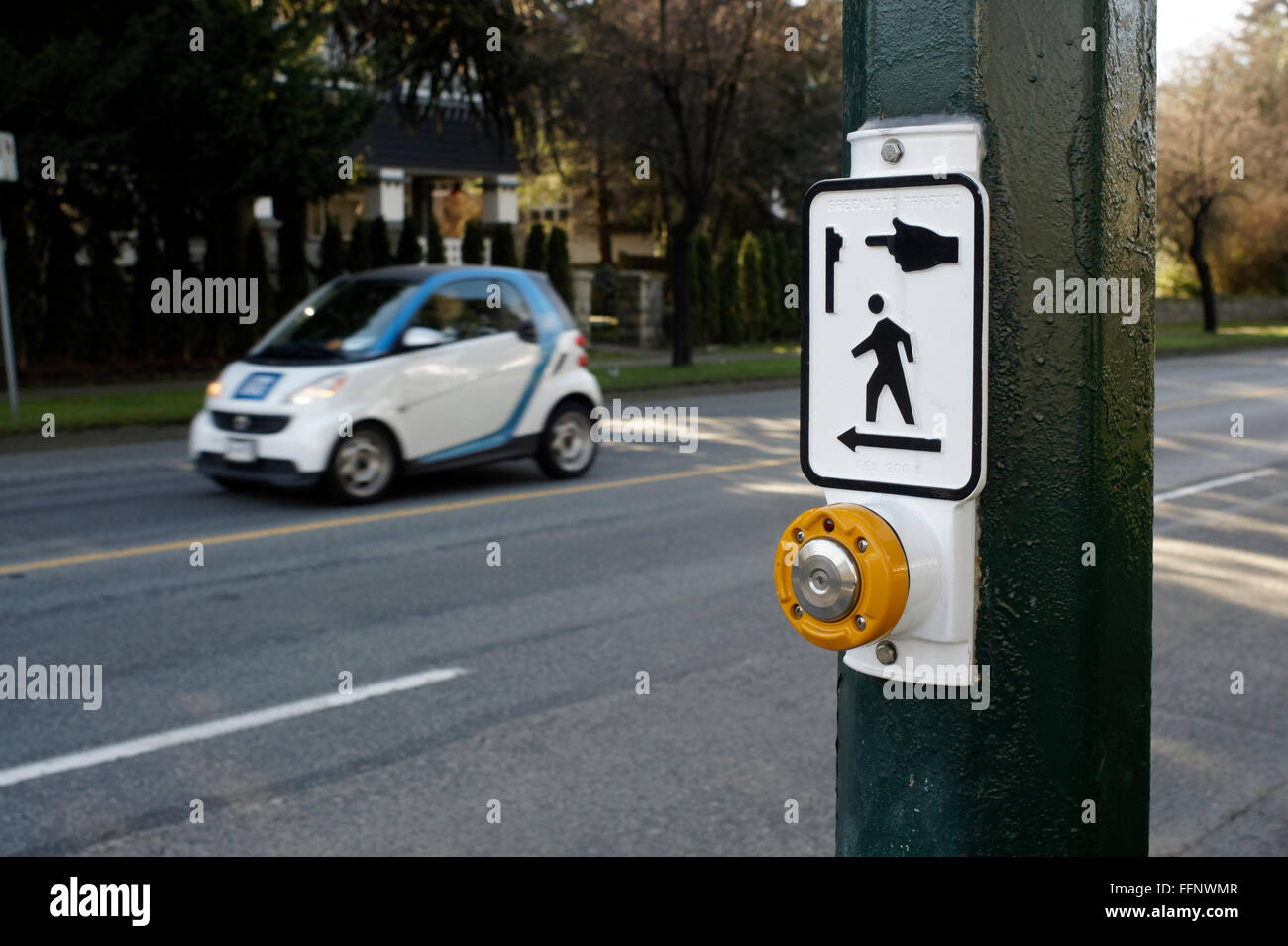 Pedestrian crosswalk signal button with street and smart car fortwo in ...