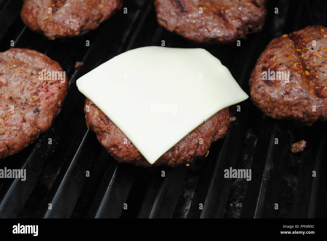 Close-Up of American Cheese Melting on a Beef Burger Stock Photo - Alamy