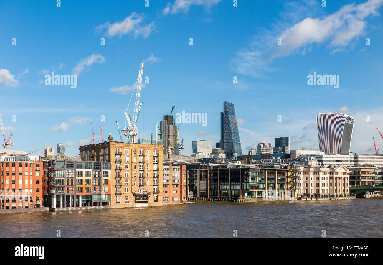 Thameside skyline on a sunny day with blue sky, with the Samuel Pepys ...