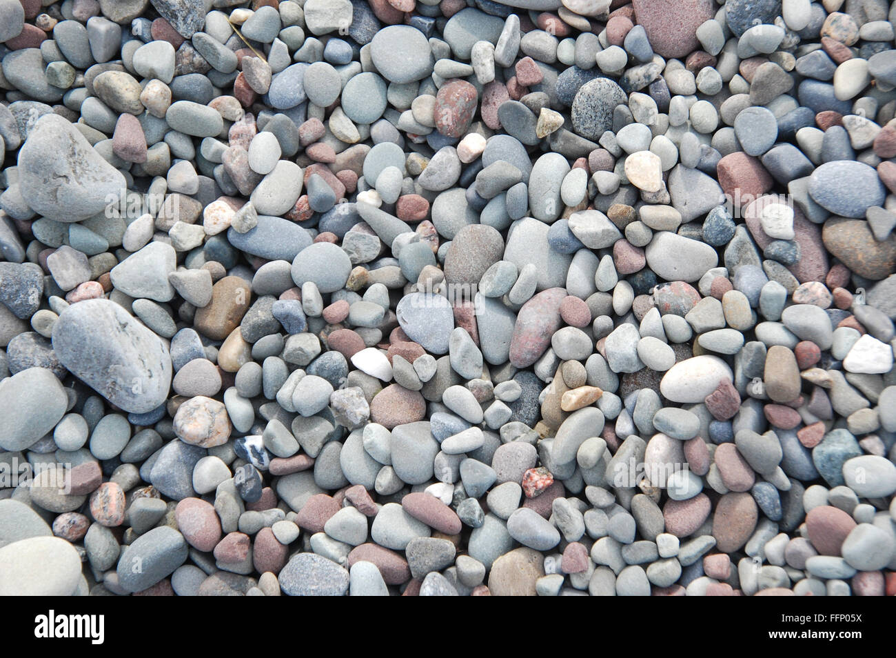 Small stones and rocks on the ground Stock Photo - Alamy