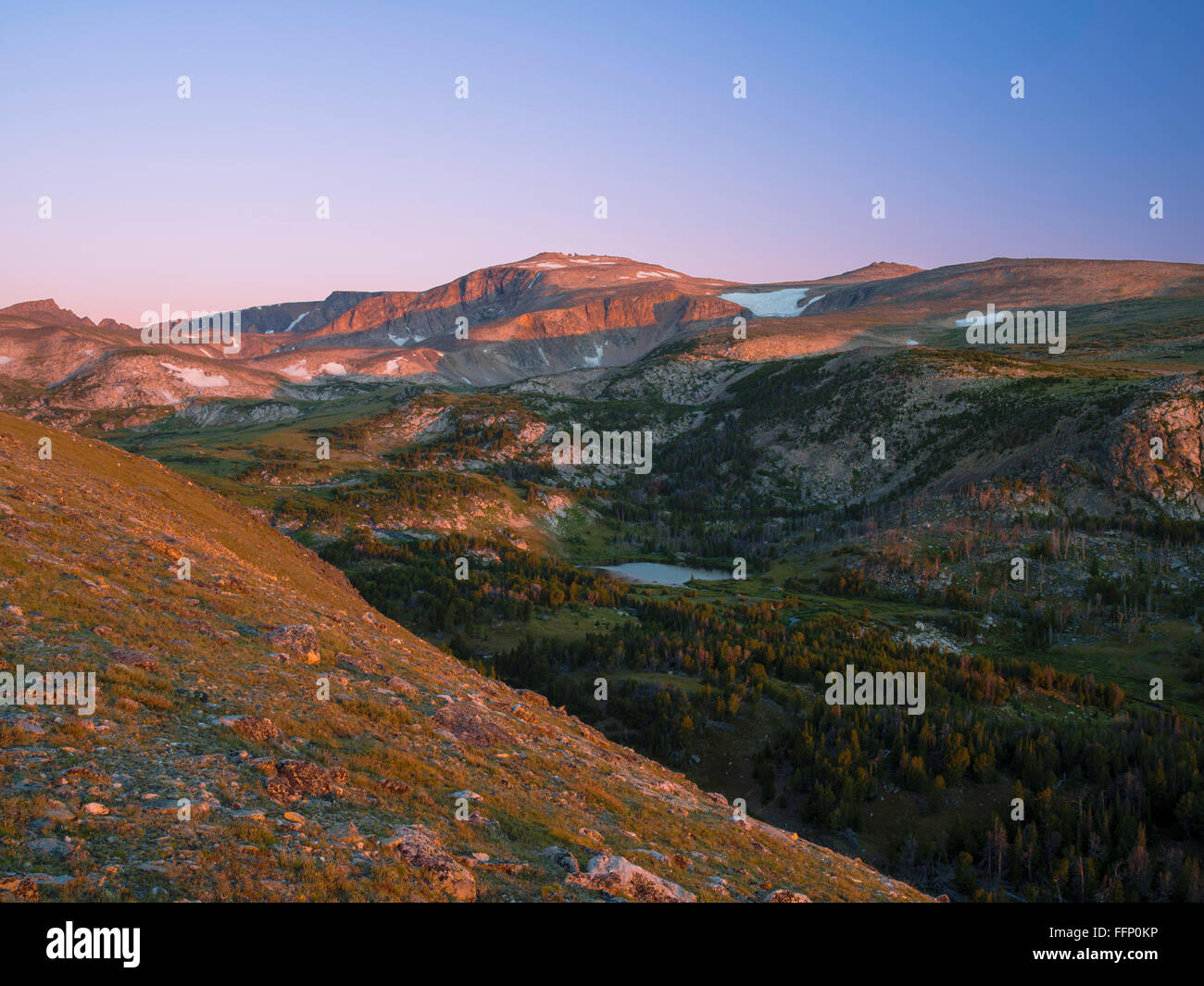 The sun rises on Mount Rearguard in the Absaroka-Beartooth Wilderness ...