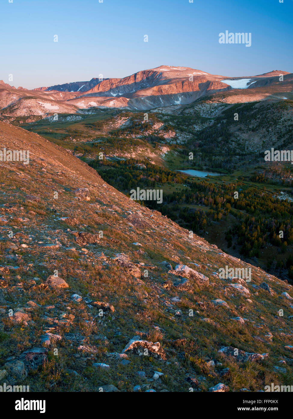 The sun rises on Mount Rearguard in the Absaroka-Beartooth Wilderness ...