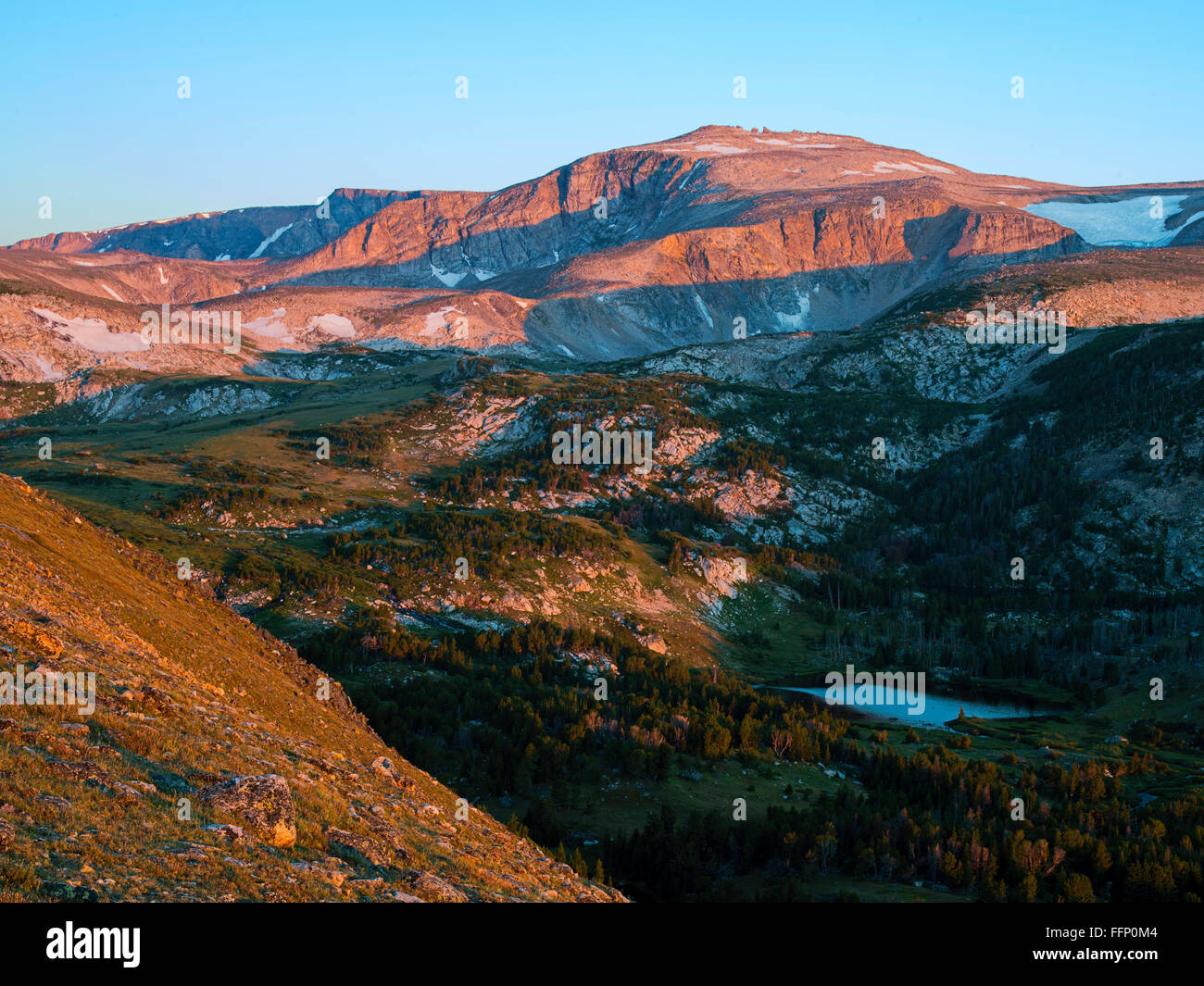 The sun rises on Mount Rearguard in the Absaroka-Beartooth Wilderness ...