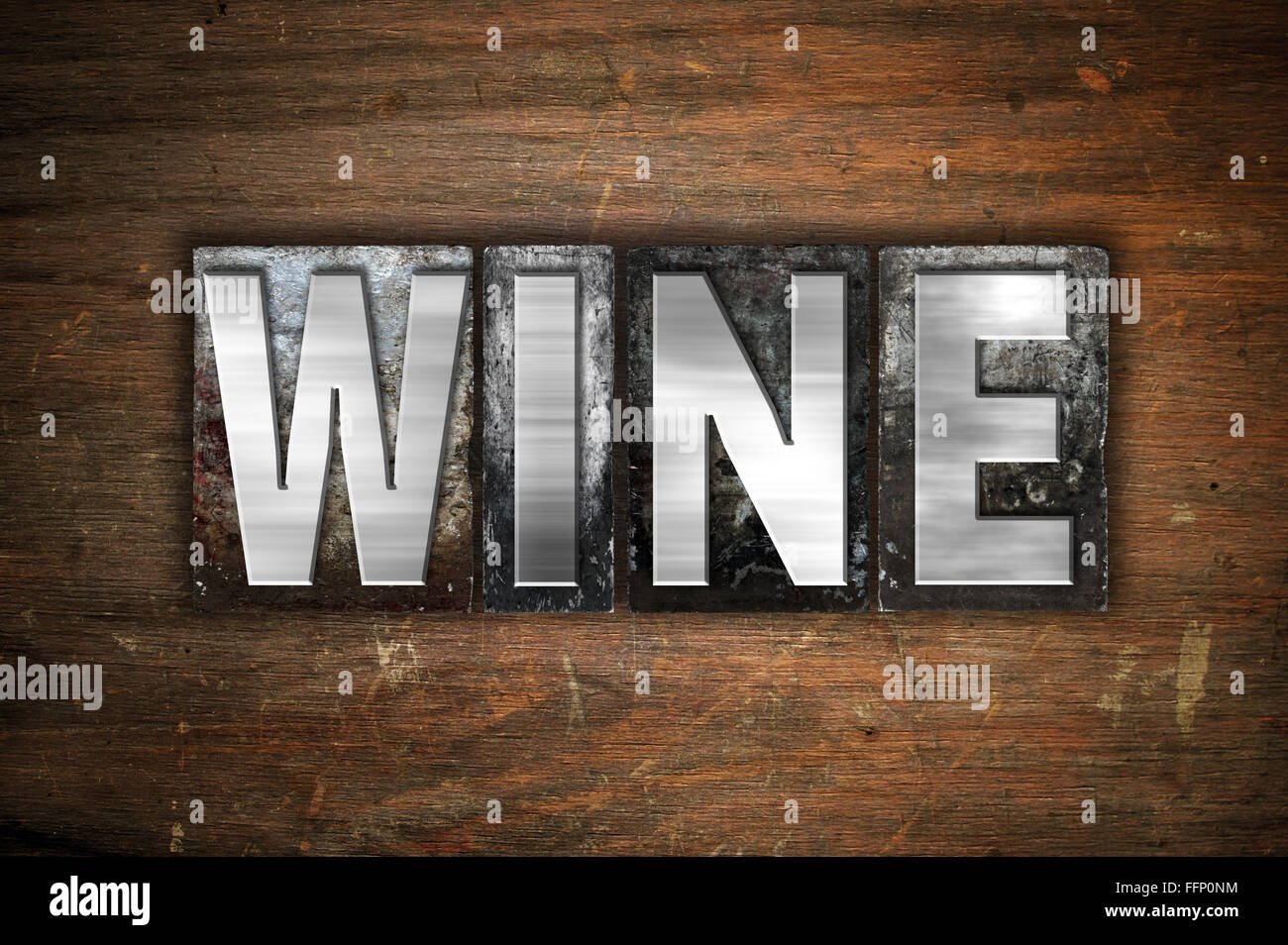 The word "WIne" written in vintage metal letterpress type on an aged ...