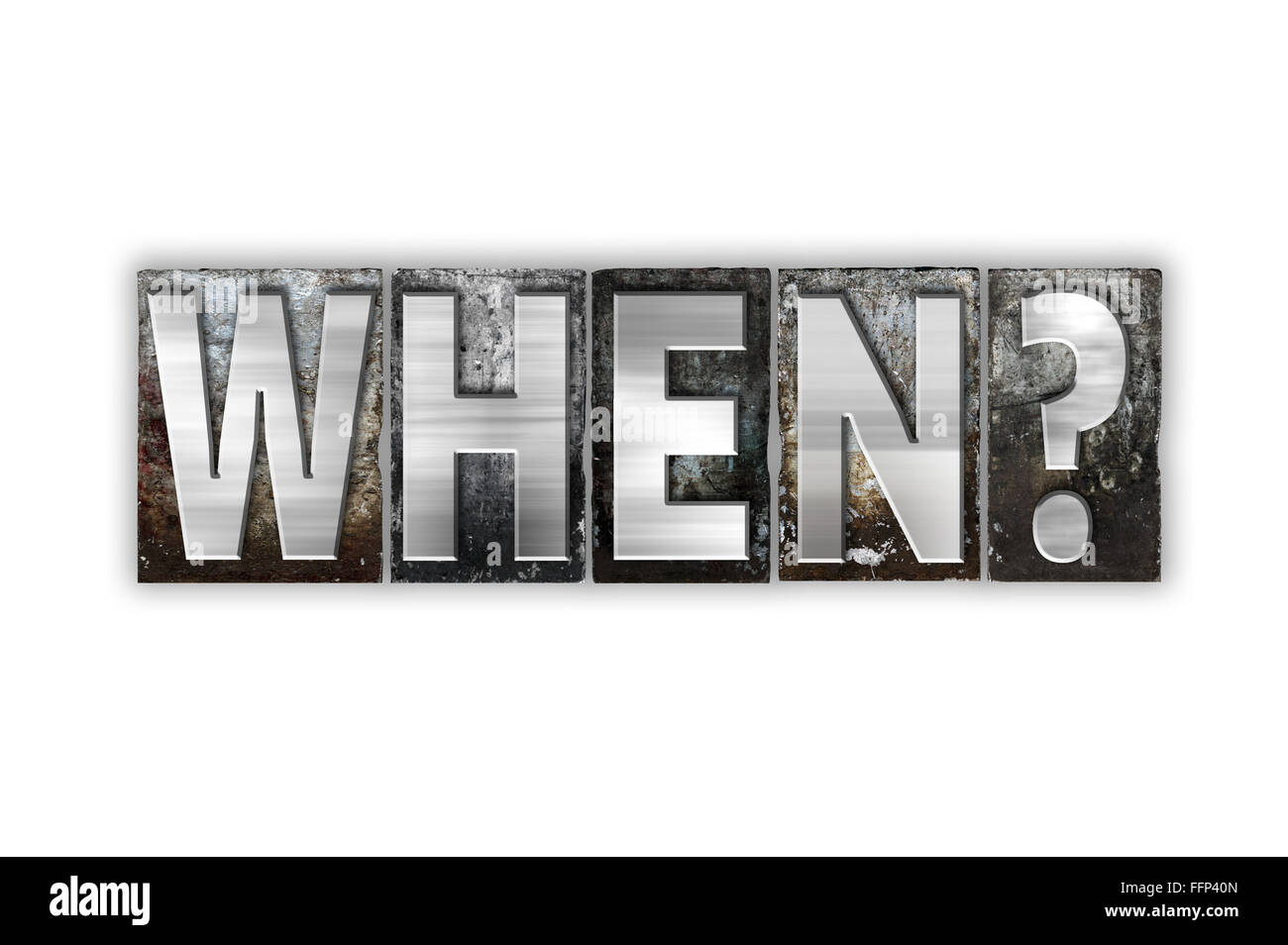 The word "When" written in vintage metal letterpress type isolated on a ...