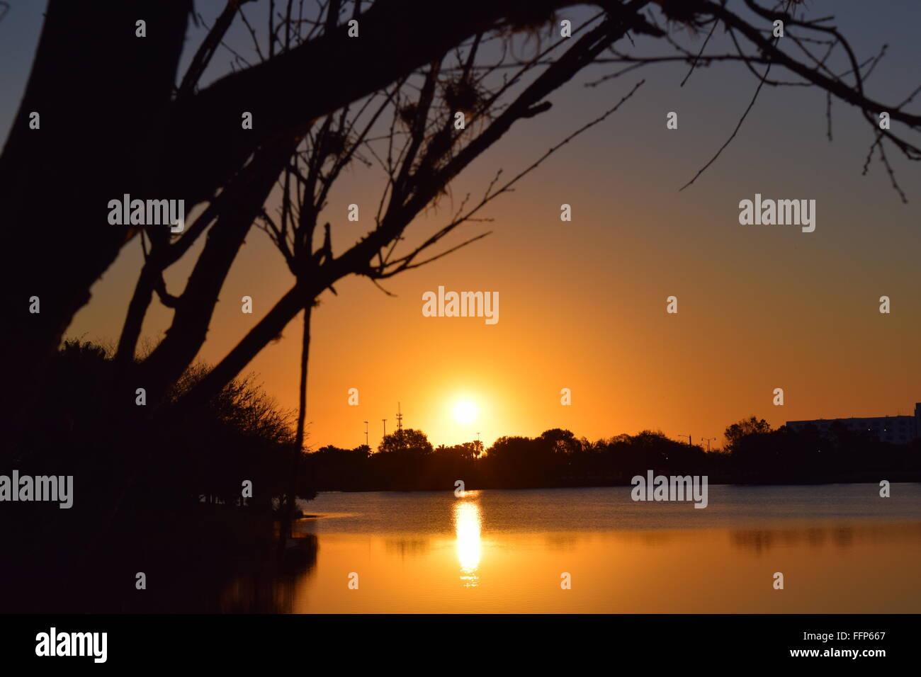 Reflection of sunset Stock Photo - Alamy