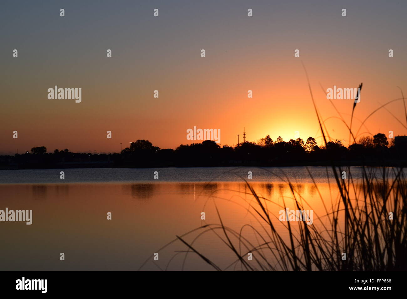 Reflection of sunset Stock Photo - Alamy