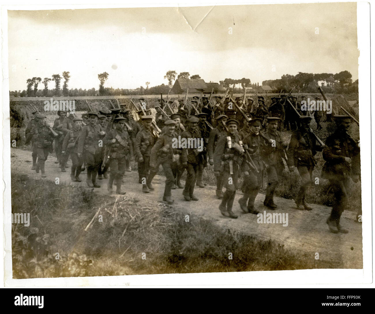 This photograph captures infantry on the march in Lestrem, France ...