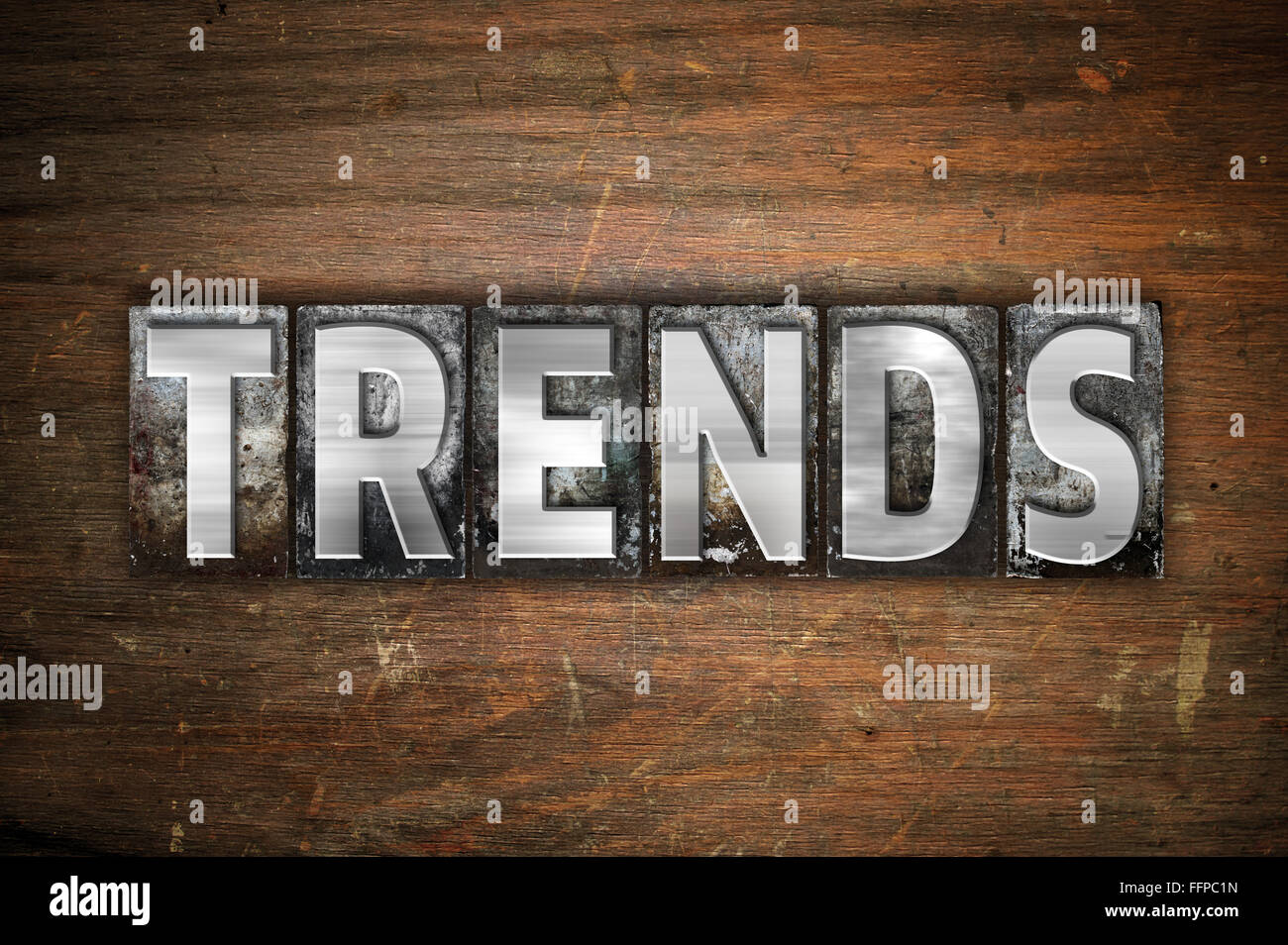 The word "Trends" written in vintage metal letterpress type on an aged ...