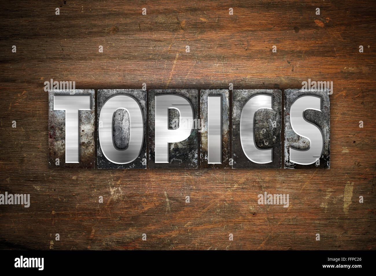 The word "Topics" written in vintage metal letterpress type on an aged ...