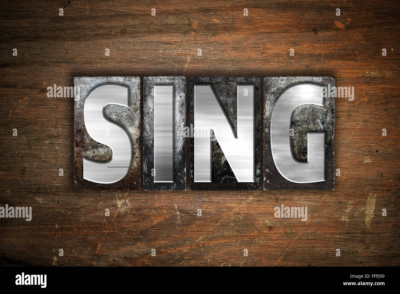 The word "Sing" written in vintage metal letterpress type on an aged ...