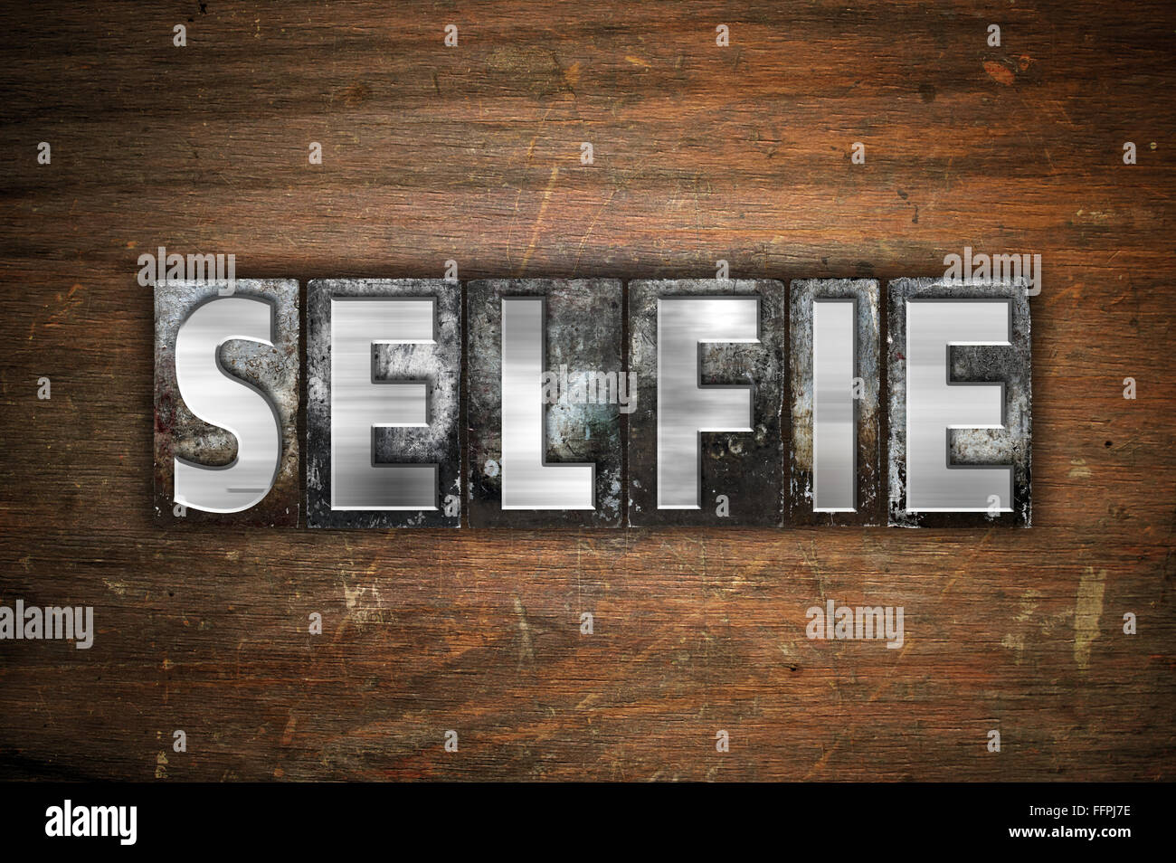 The word "Selfie" written in vintage metal letterpress type on an aged ...