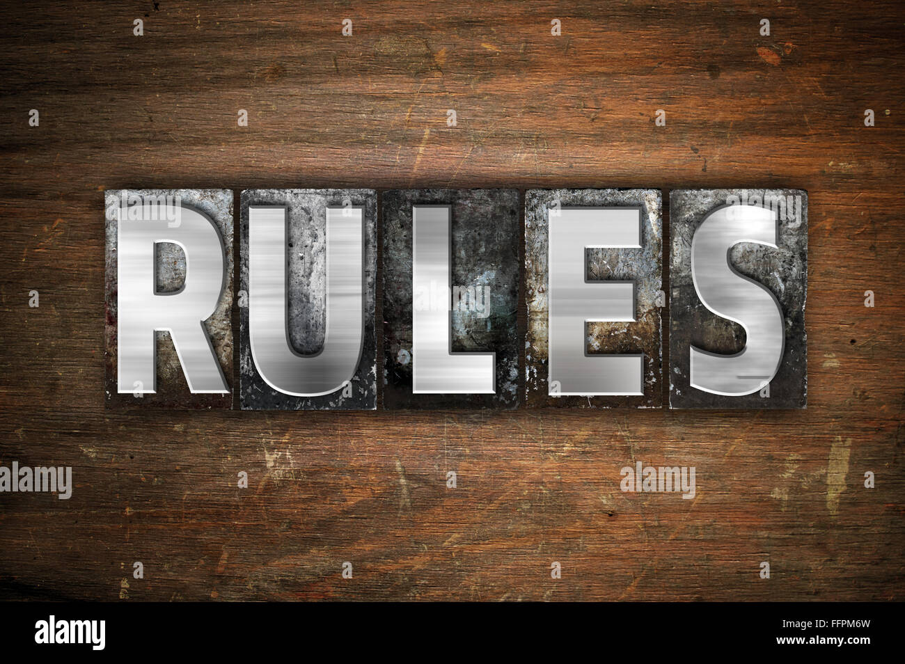 The word "Rules" written in vintage metal letterpress type on an aged ...