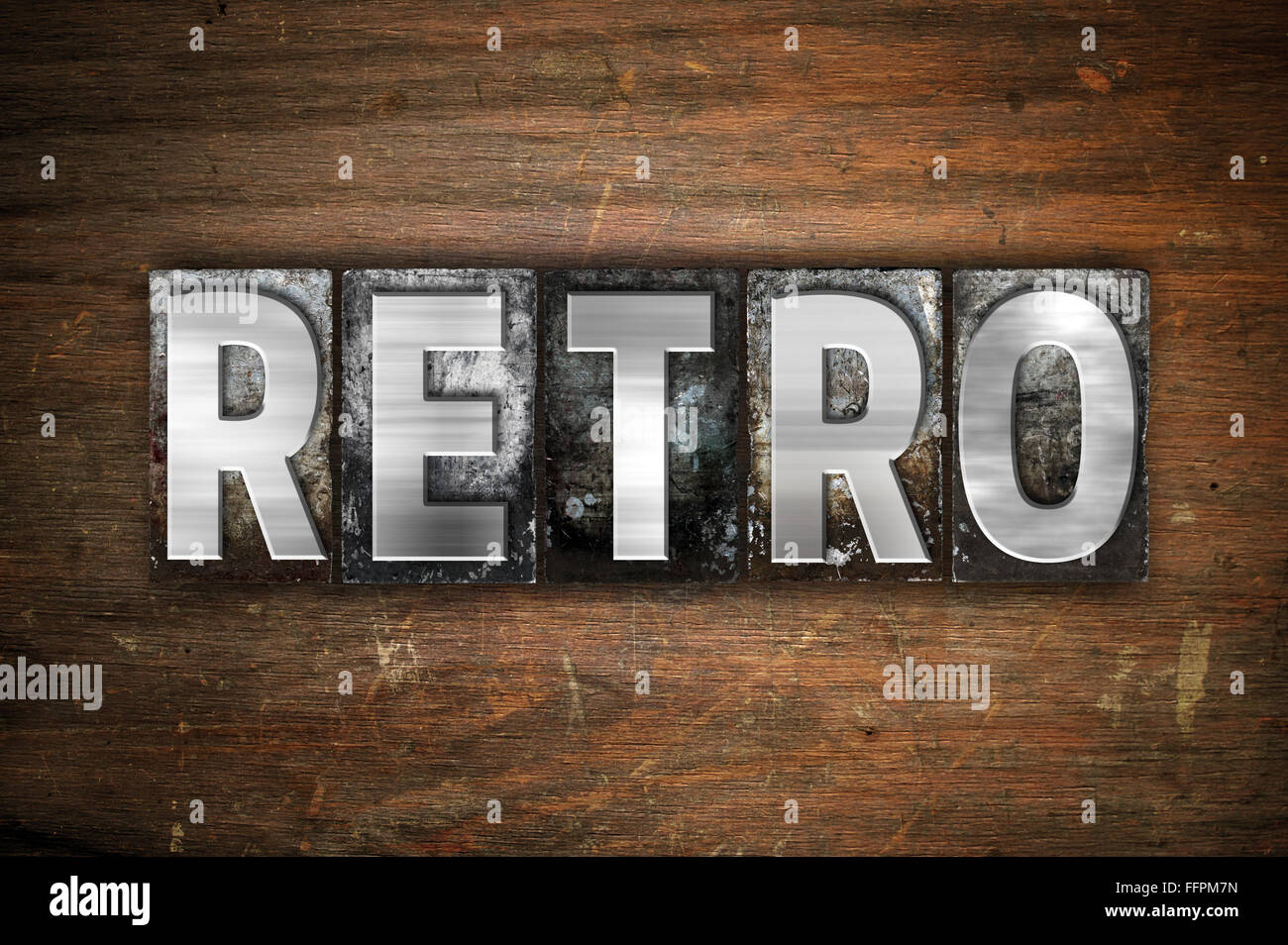 The word "Retro" written in vintage metal letterpress type on an aged ...