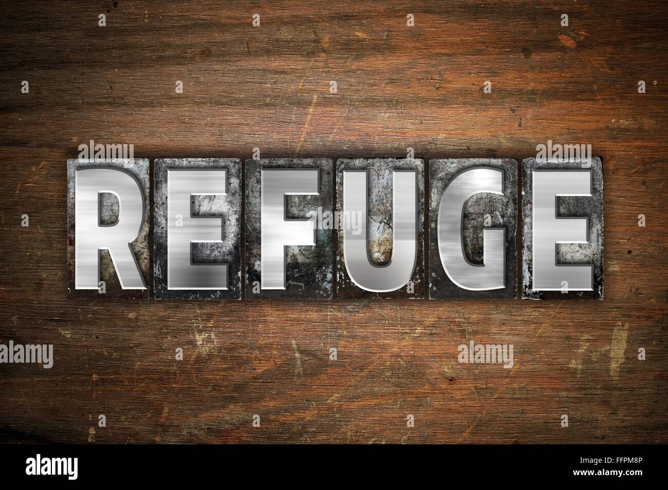 The word "Refuge" written in vintage metal letterpress type on an aged ...