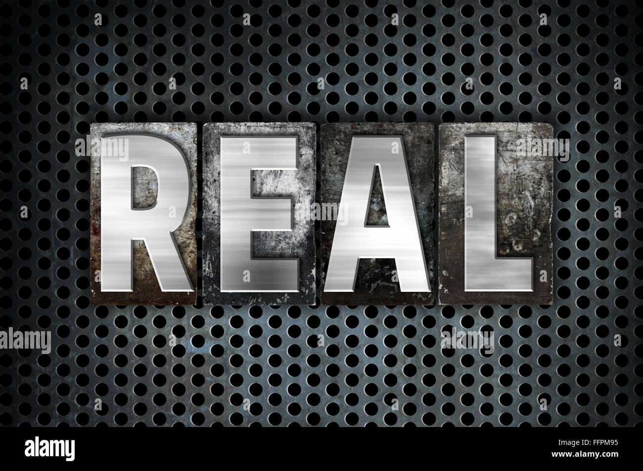 The word "Real" written in vintage metal letterpress type on a black ...