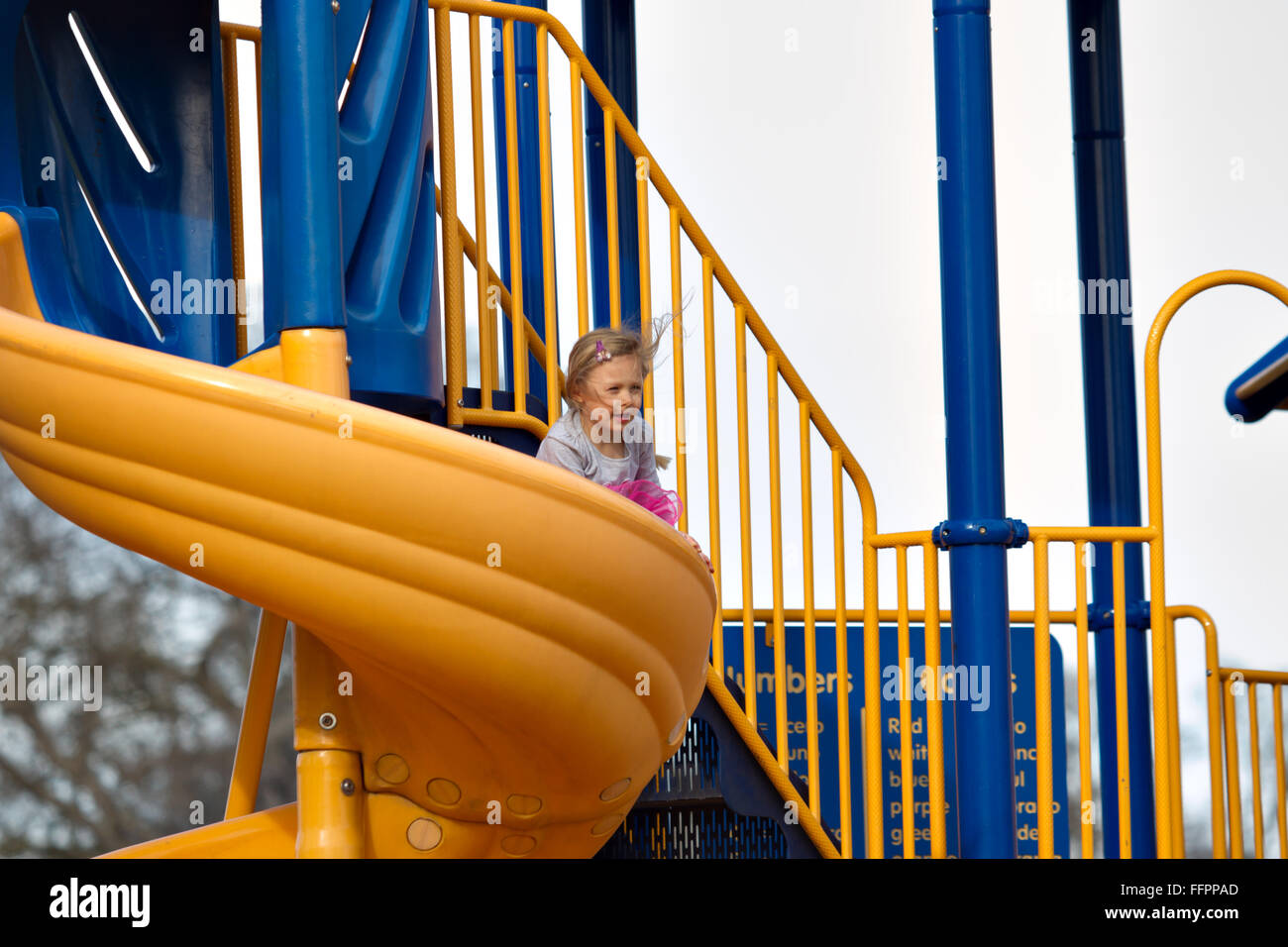 Girl going down a slide hi-res stock photography and images - Alamy