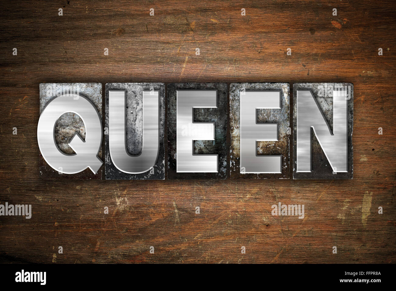 The word "Queen" written in vintage metal letterpress type on an aged ...