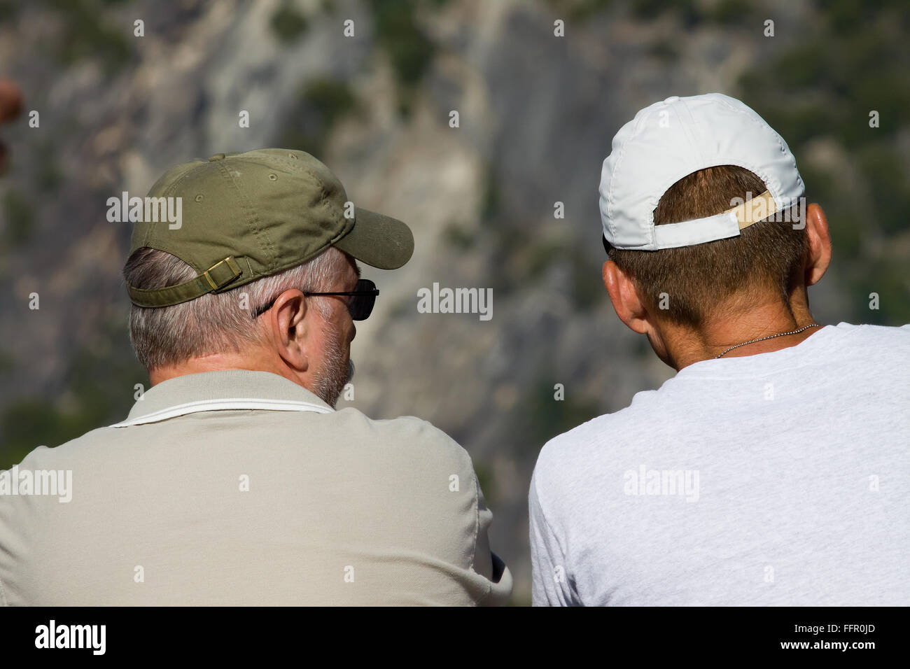 Two men having a serious discussion in an outdoor setting Stock Photo ...