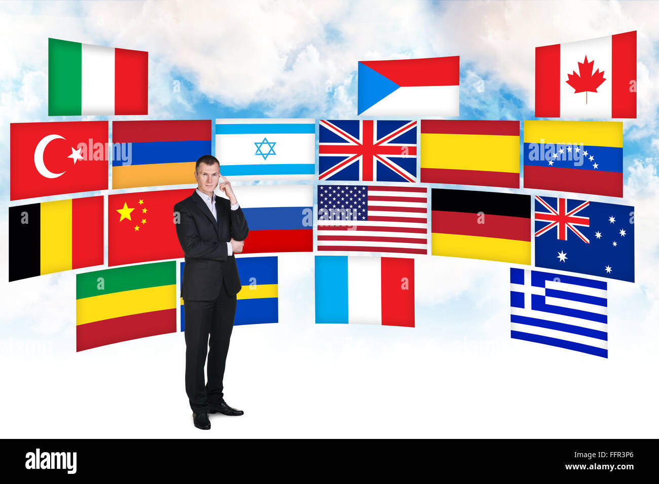 Businessman stands on the many different countries flags background ...
