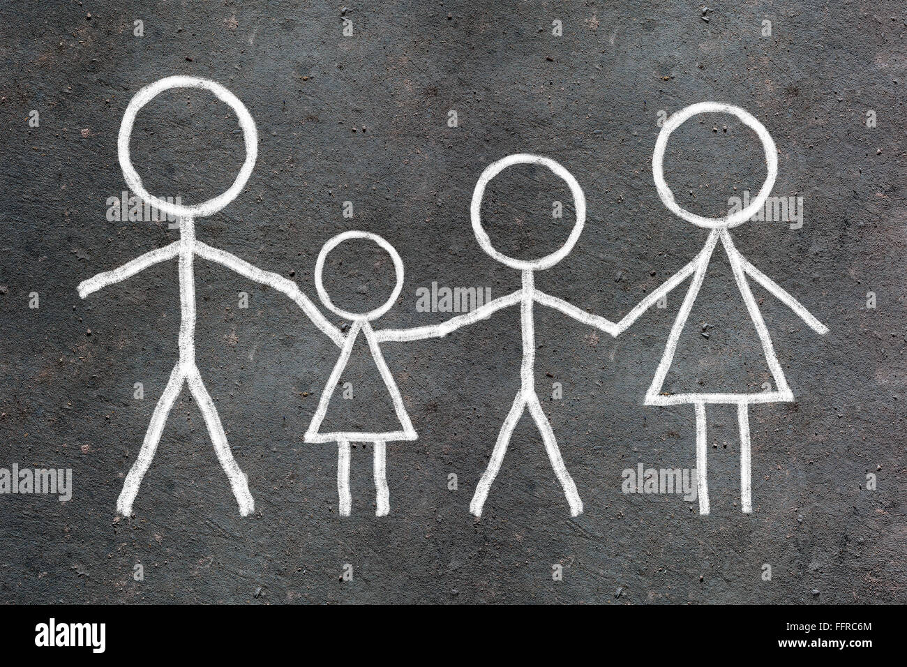 Family drawn in chalk on the gray wall Stock Photo - Alamy