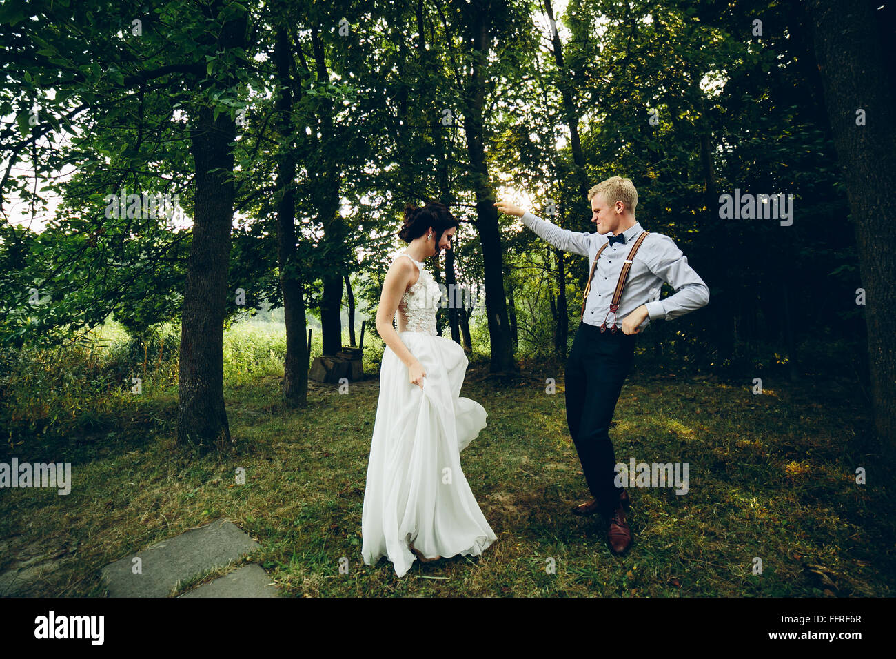 bride and groom dancing in nature Stock Photo - Alamy