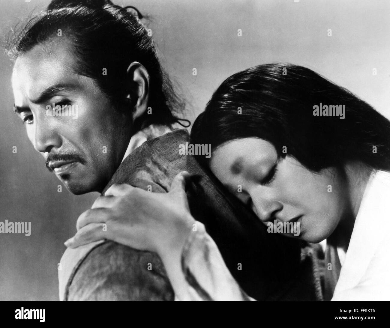 RASHOMON, 1950. /nMasayuki Mori (left) and Machiko Kyo in a scene from ...